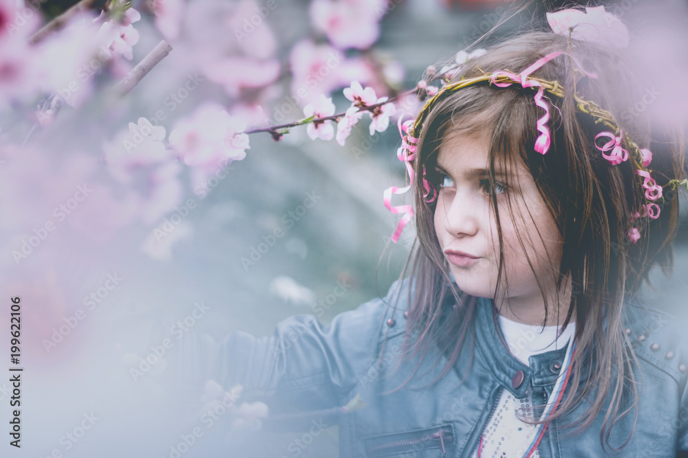 Beautiful little girl with flower wreath on her hair, traditionally ...