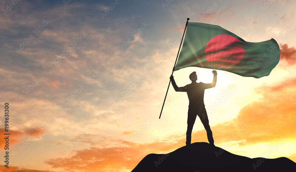 Bangladesh flag being waved by a man celebrating success at the top of ...