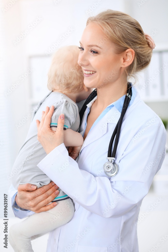 Pediatrician is taking care of baby in hospital. Little girl is being ...