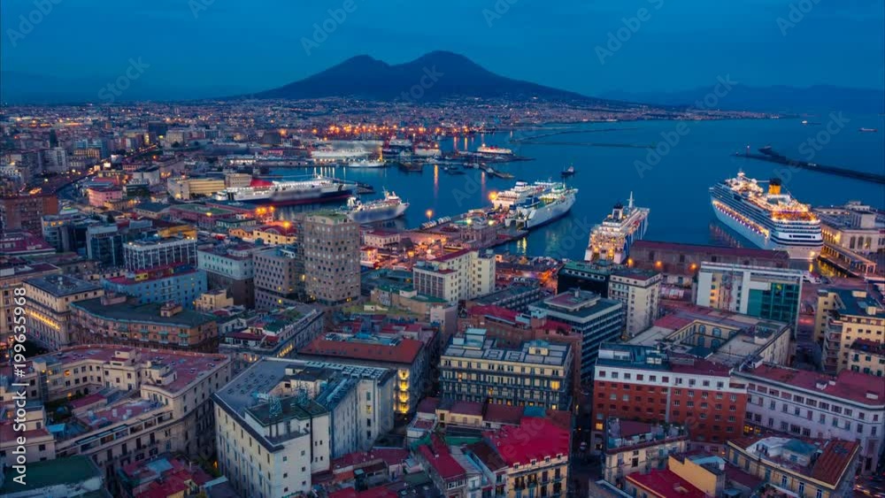 Naples, Italy. Time lapse aerial view of the evening city with seaport ...