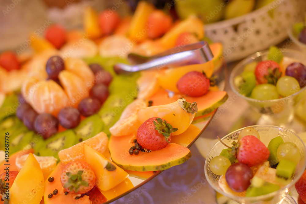 Colorful fruit platter with a large variety of exotic and season fruit ...