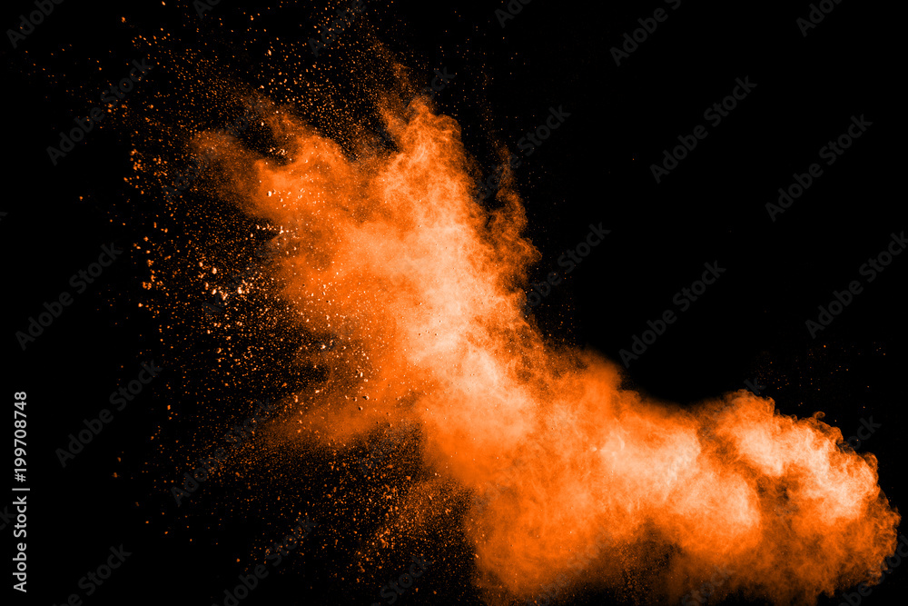 abstract orange dust explosion on black background. abstract orange ...