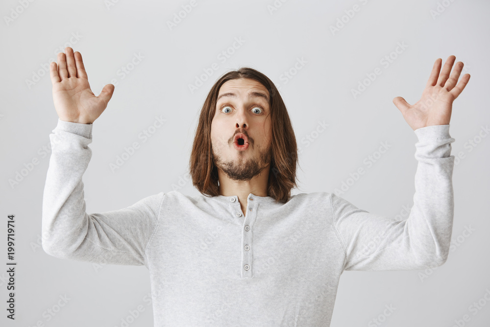 Wave of shock sweep him from feet. Portrait of shocked attractive ...