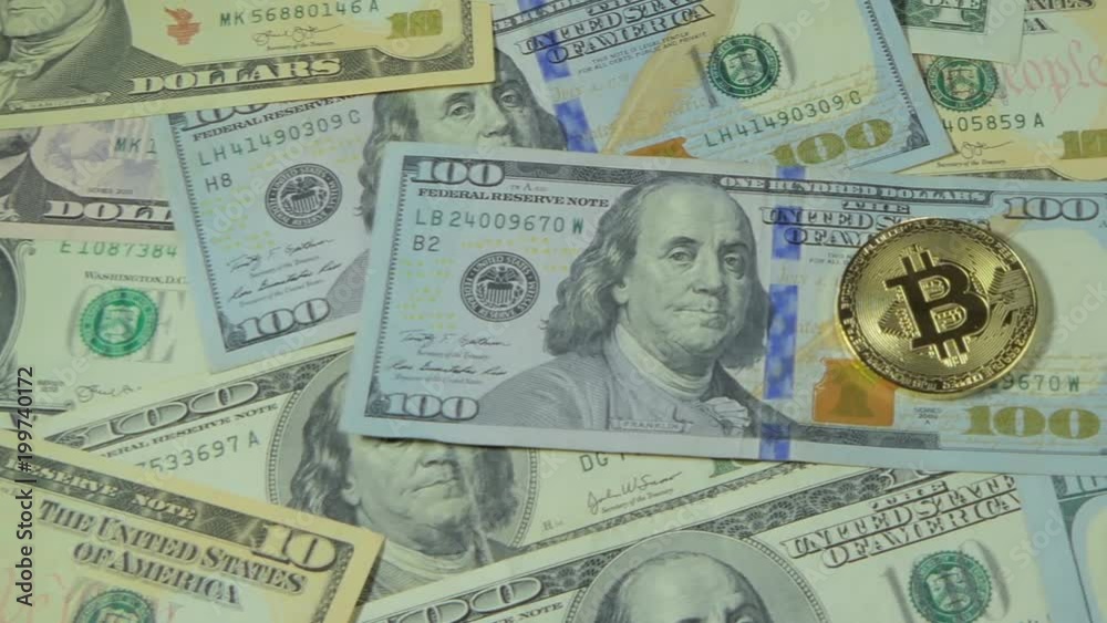 Dolly shot of Gold Bitcoin, BTC coins, on banknotes US dollars. BTC ...