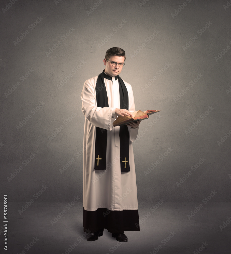 young priest in giving his blessing Stock Photo | Adobe Stock
