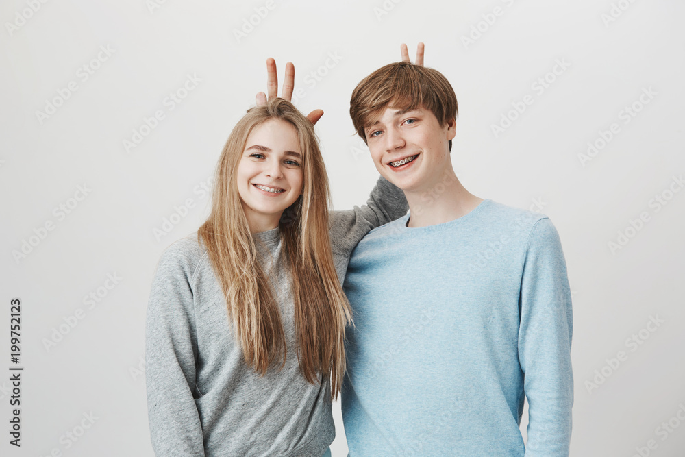 Two best friends together since school. Funny joyful guy and girl with ...