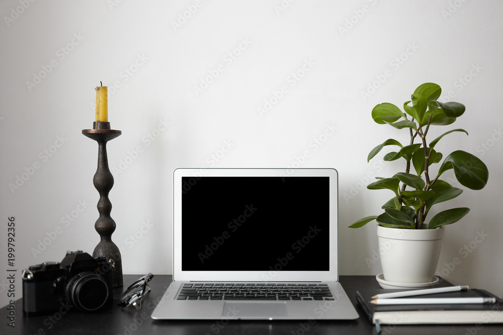 Empty workspace of travel blogger or photographer with camera, glasses ...
