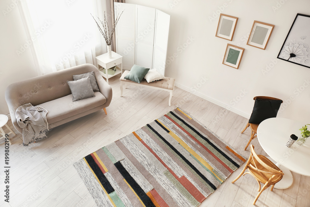 Living room interior with comfortable sofa, view through CCTV camera ...