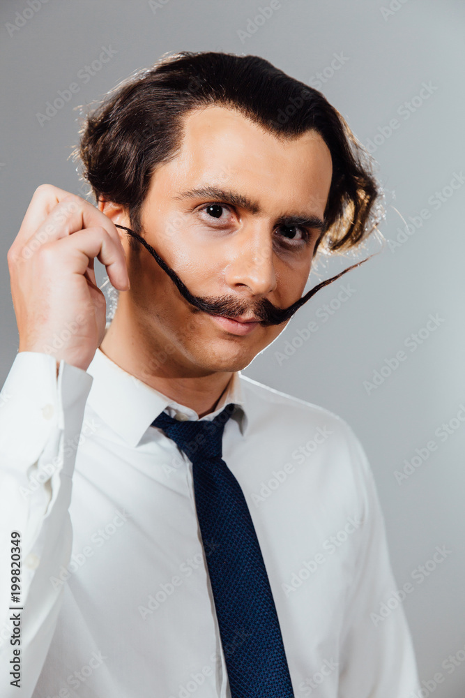 eccentric man with a long mustache in his shirt and tie. A mad office ...
