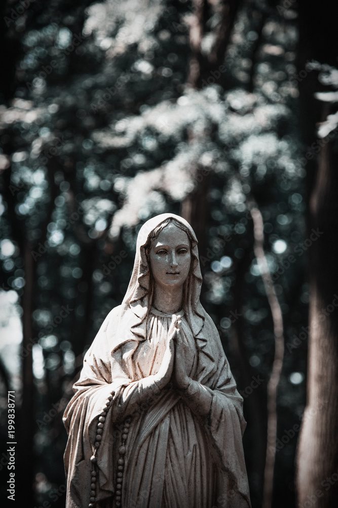 Virgin Mary statue. Vintage sculpture of sad woman in grief (Religion ...