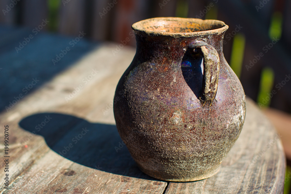 Old pitcher.An ancient decanter. Clay vessel. Ancient water tank Stock ...