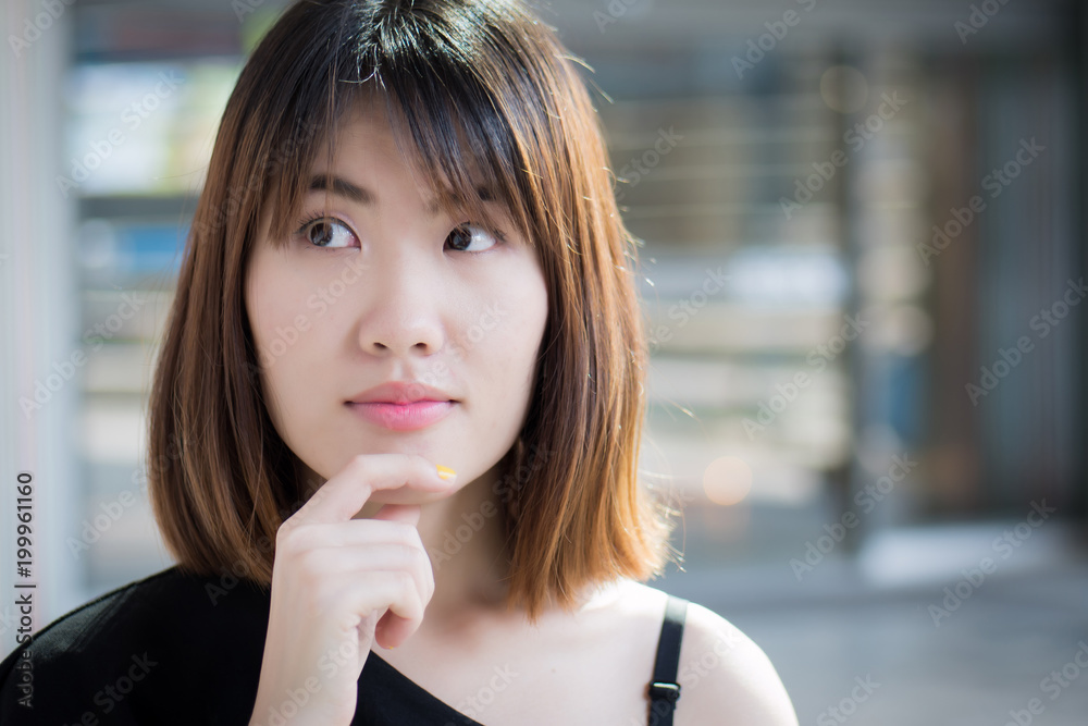smart thoughtful woman thinking, planning; portrait of asian woman ...