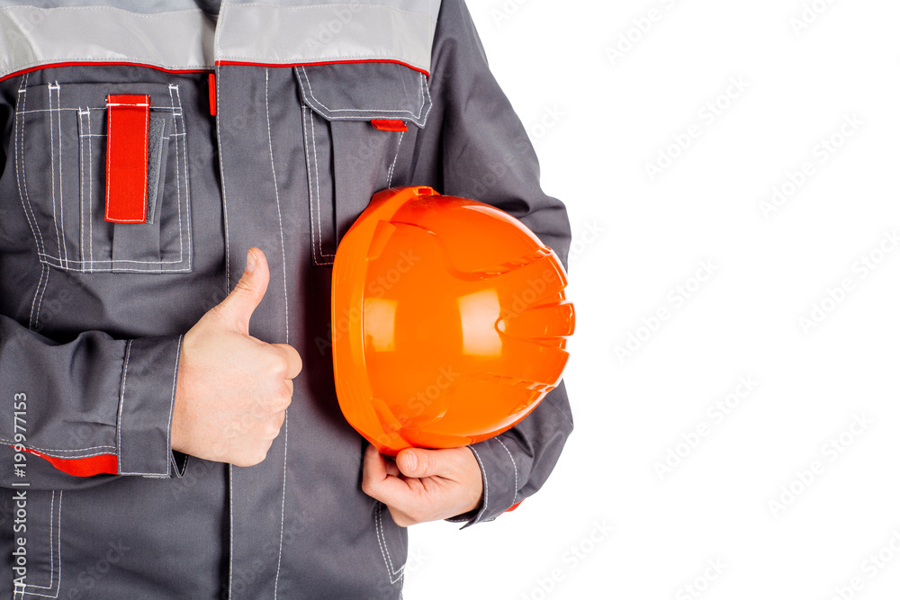 builder with helmet and like gesture over white wall background. repair ...