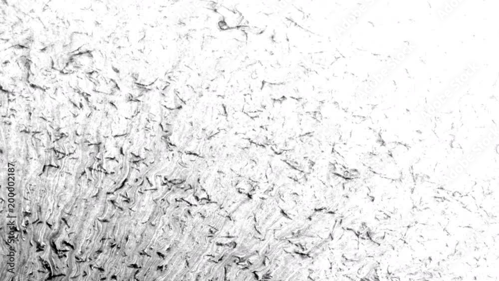 Black ink spreading on white background with an amazingly detailed ...