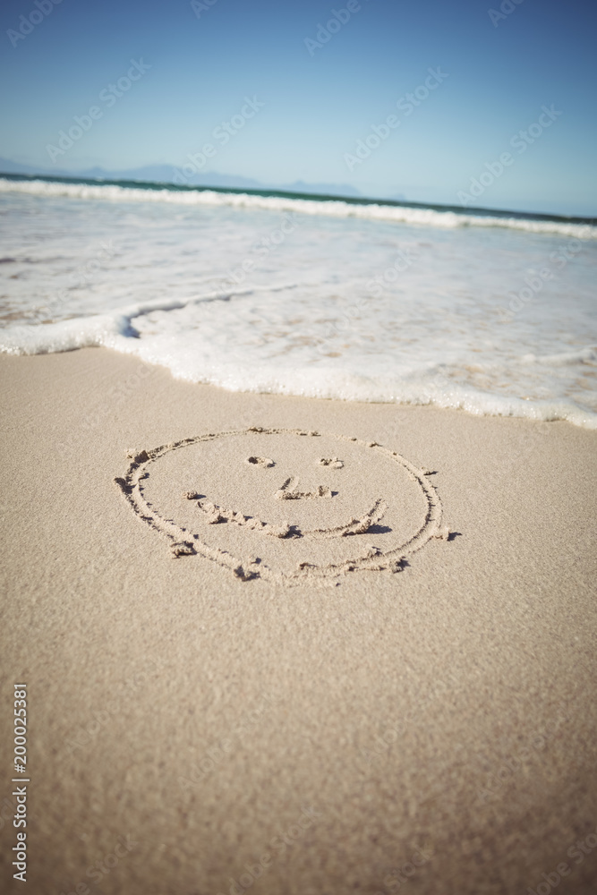 Smiley drawn on the sand Stock Photo | Adobe Stock