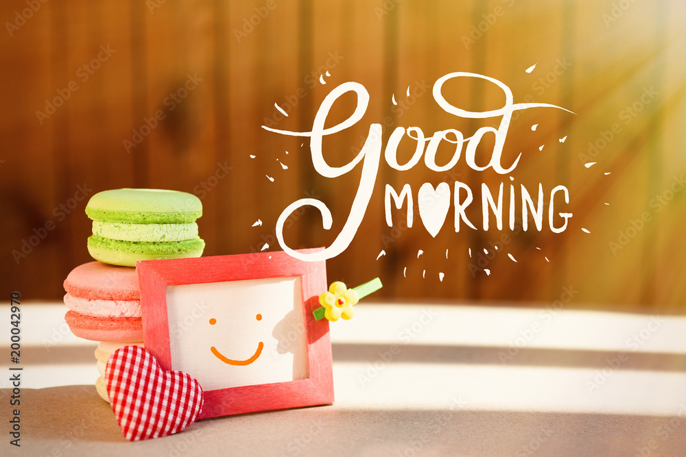 Morning surprise, colored cakes makarons with a card. The inscription ...