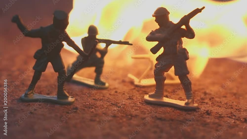 Video Stock toy soldier in the fire. The model of the battle scene. The ...