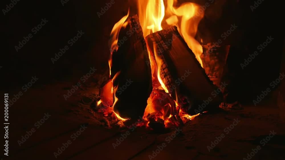 Birch logs burning slowly with soft orange flames in slow motion hd ...