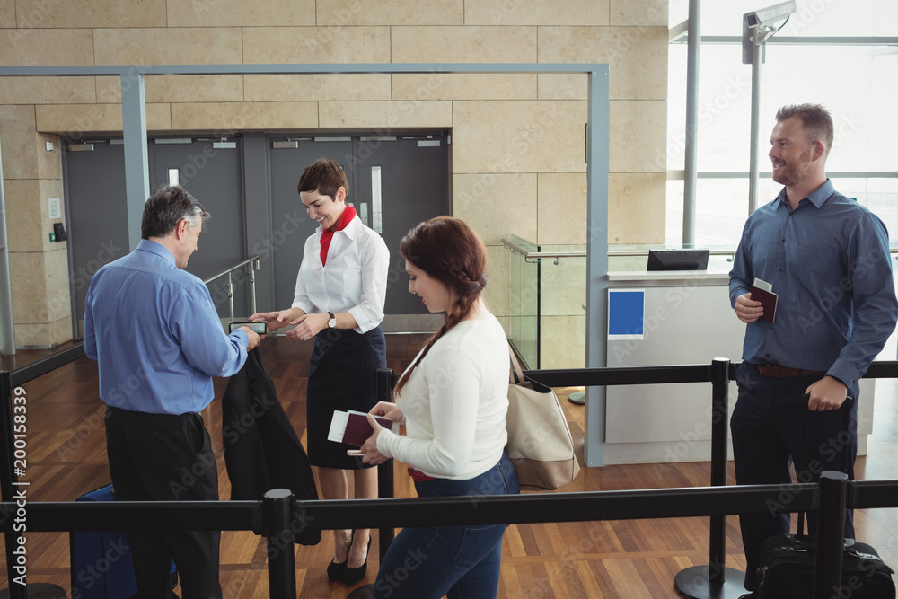 Businessman showing his boarding pass at the check-in counter Stock ...