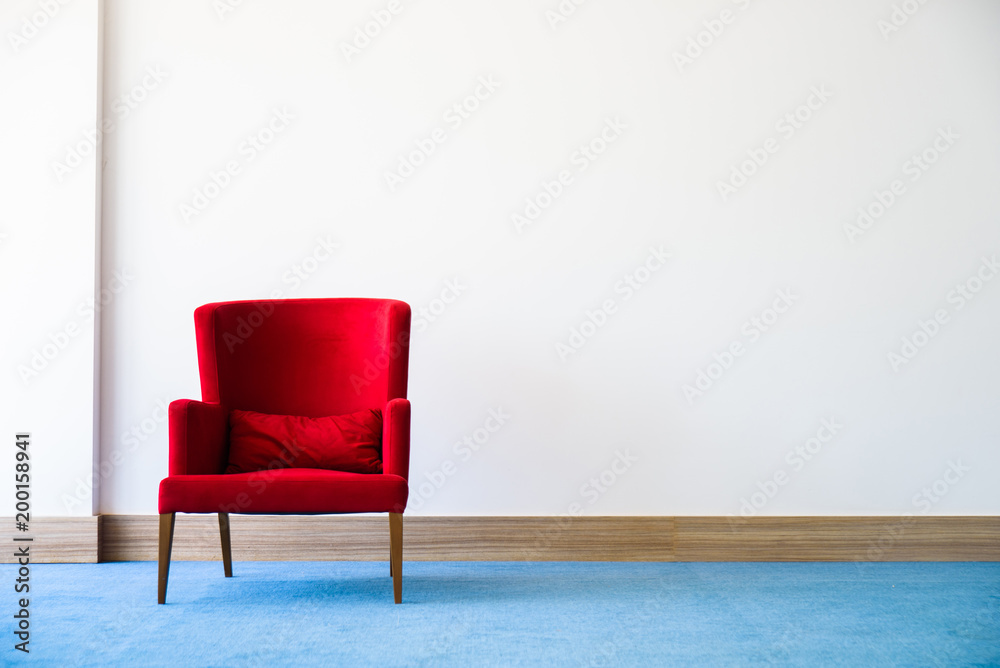 Red chair in white wall interior with blue wood flooring. Stock Photo ...