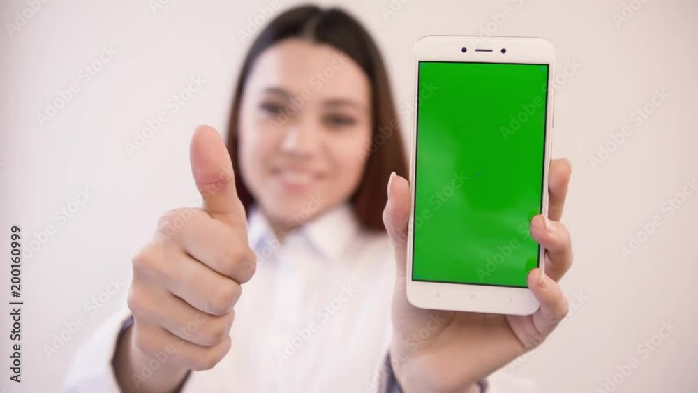 Business woman showing smartphone screen with sustainable development ...