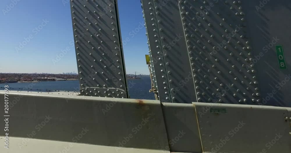 Driving Plate side 90 degree angle view out car driving over Throgs ...