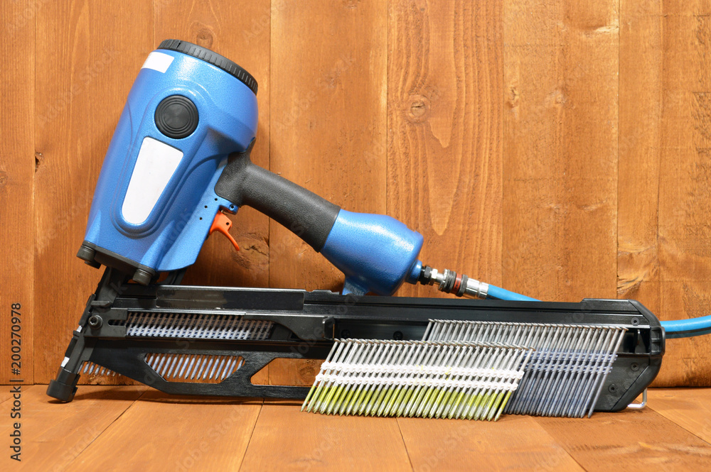 pneumatic nail gun Stock Photo | Adobe Stock