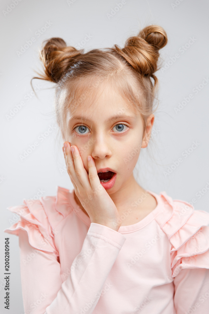 Little girl surprised expression on gray background Stock Photo | Adobe ...