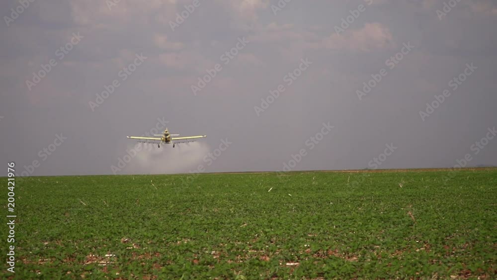 Airplane spraying field Stock Video | Adobe Stock