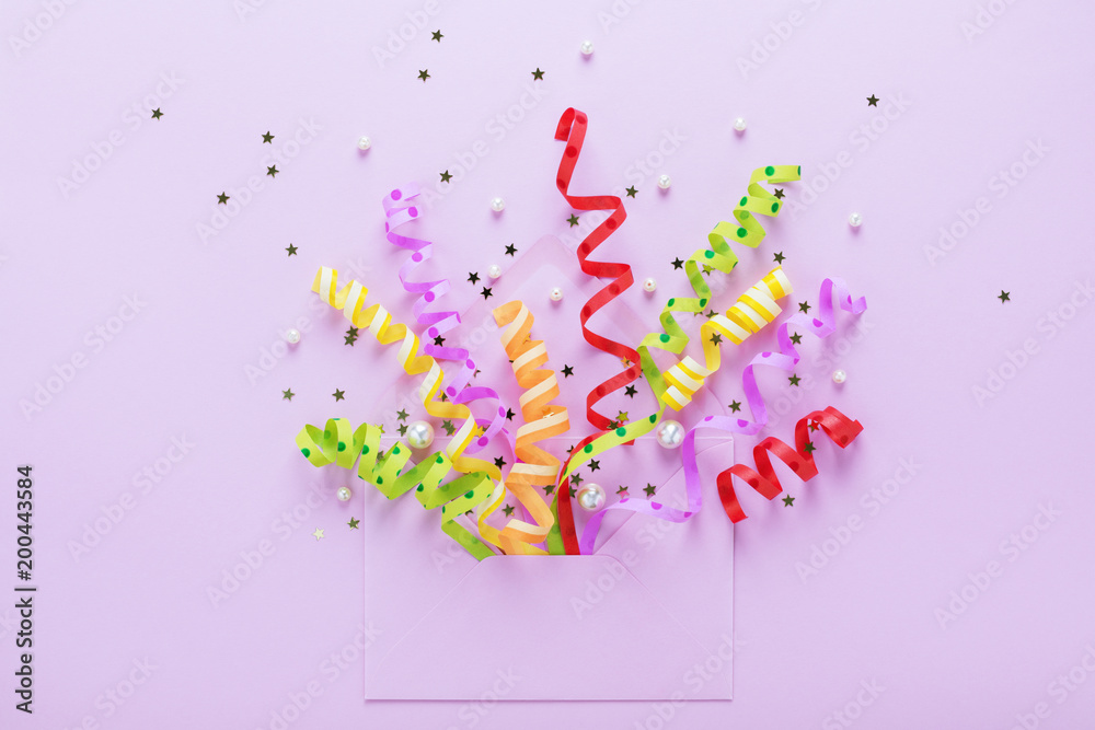 Party confetti explosion & opened envelope on violet card Stock Photo ...