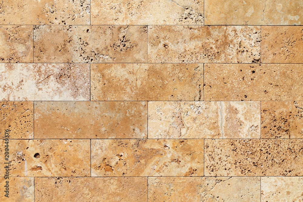 Natural Italian stone. Smooth travertine surface. A sample of wall ...