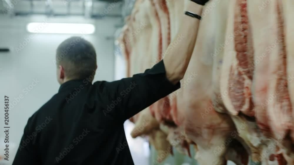 happy smiling funny butcher having fun in slaughterhouse near the ...