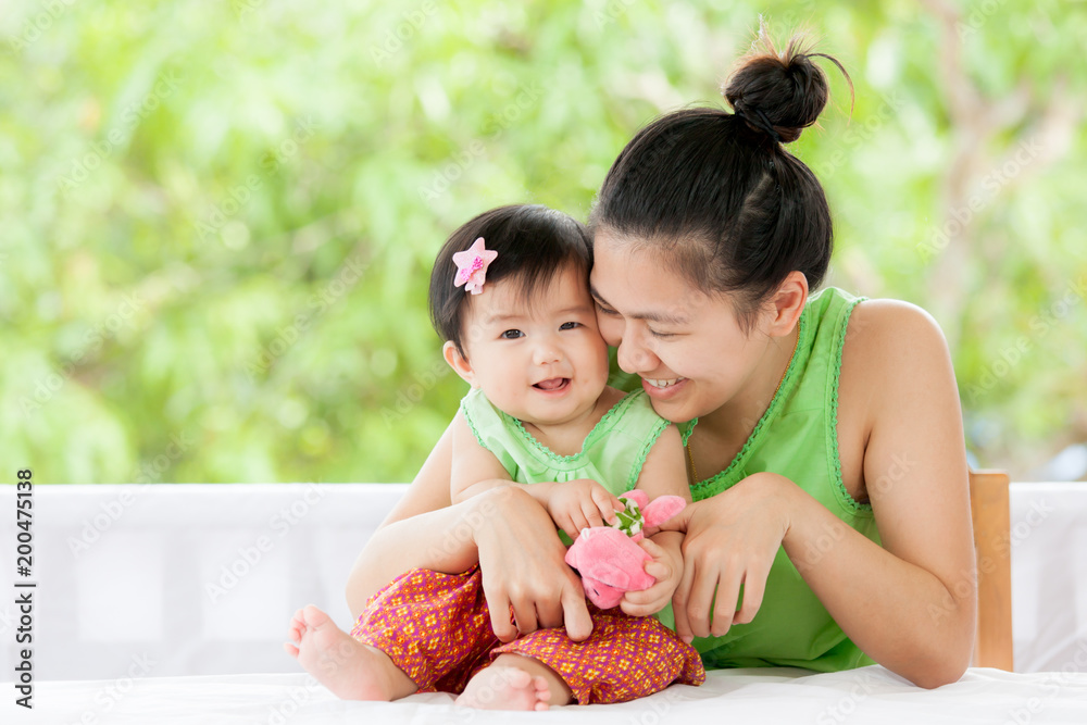 Cute asian baby girl in Thai traditon dress smiling and playing with ...