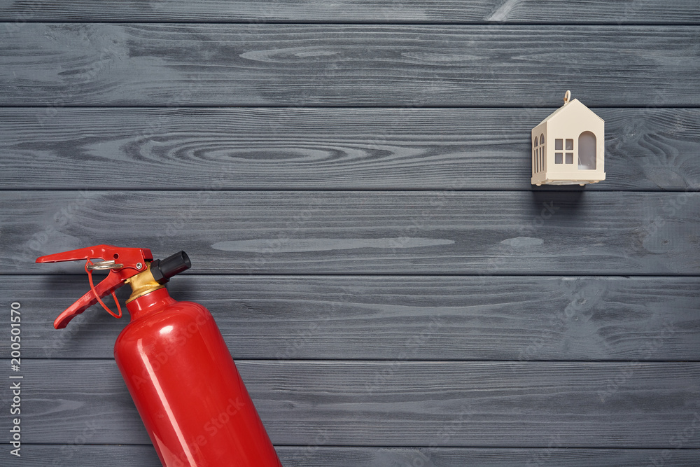 Residence fire safety. Top view of red fire extinguisher and small ...