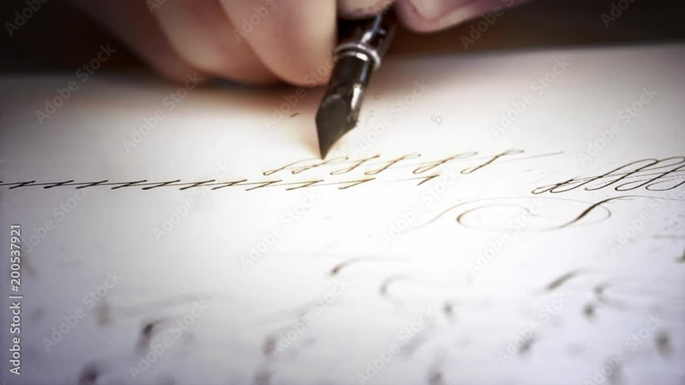 Macro view of old-fashioned handwriting with fountain pen and ink, male ...