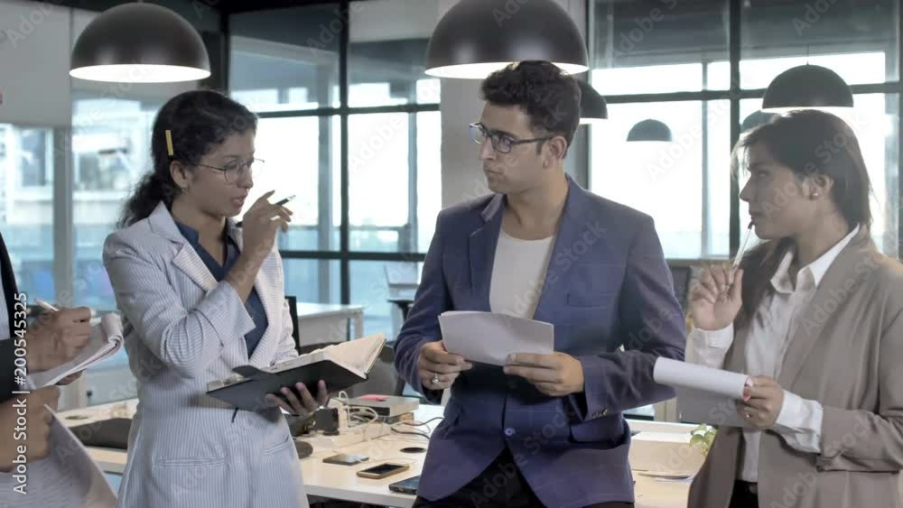 Video Stock A smart female group leader or boss standing with a ...