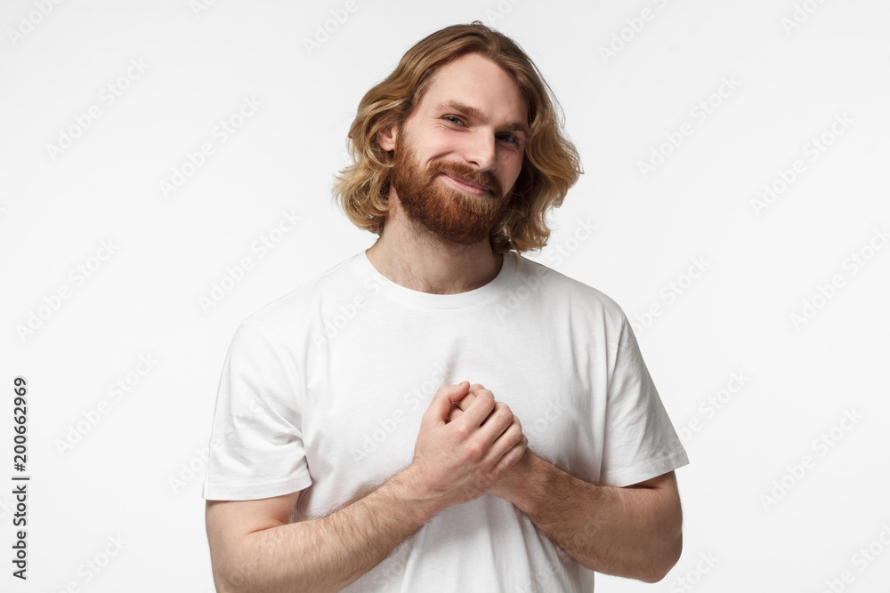 Kind hearted friendly nice bearded guy shows kindness, wearing blank ...
