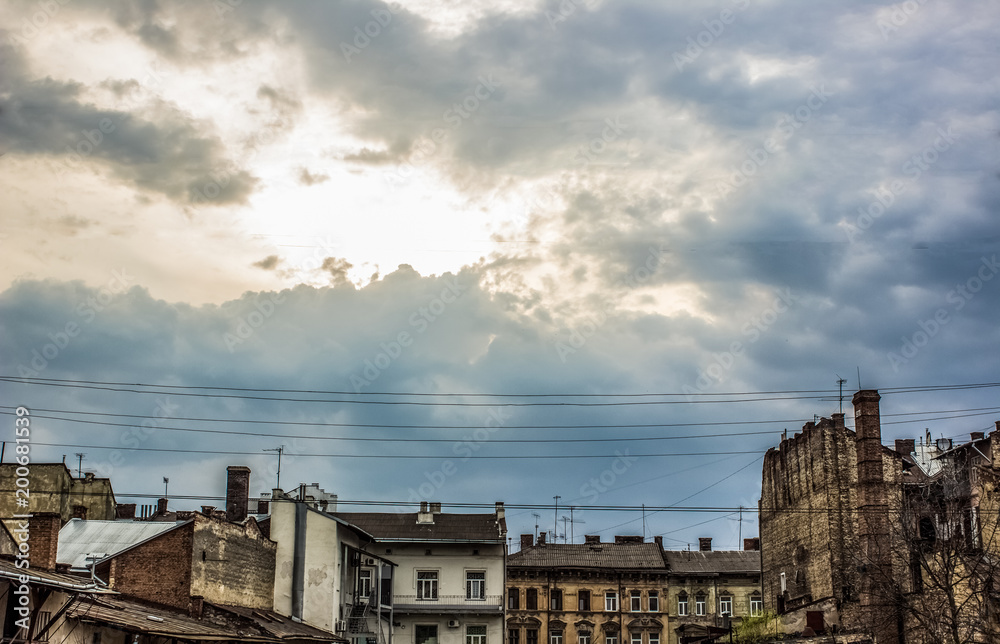 backstreet poor and dirty buildings in bad city district on grey sky ...