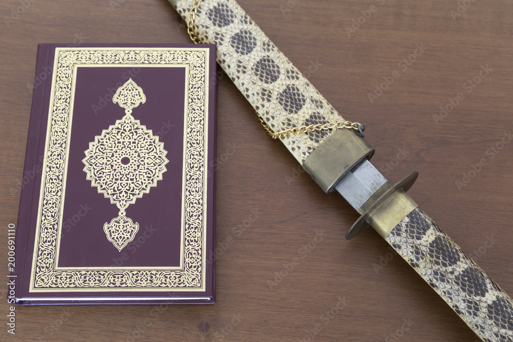 Sword and Quran on the lectern. The biggest gun is a book.Ramadan concept. foto de Stock | Adobe ...
