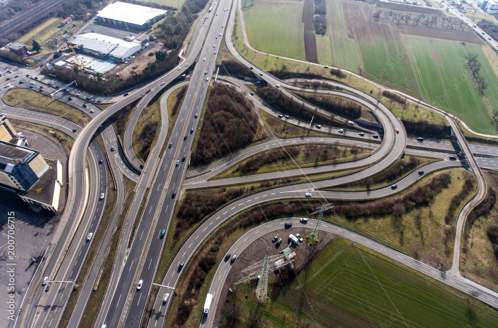 Aerial view of a highway intersection with a clover-leaf interchange ...
