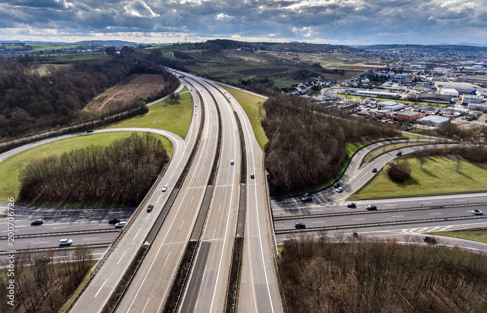 Aerial view of a highway intersection with a clover-leaf interchange ...