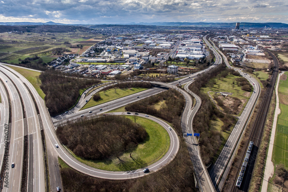 Aerial view of a highway intersection with a clover-leaf interchange ...