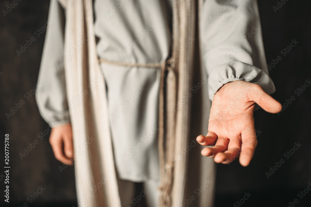Foto de Man in the image of Christ reaching out his hand do Stock ...