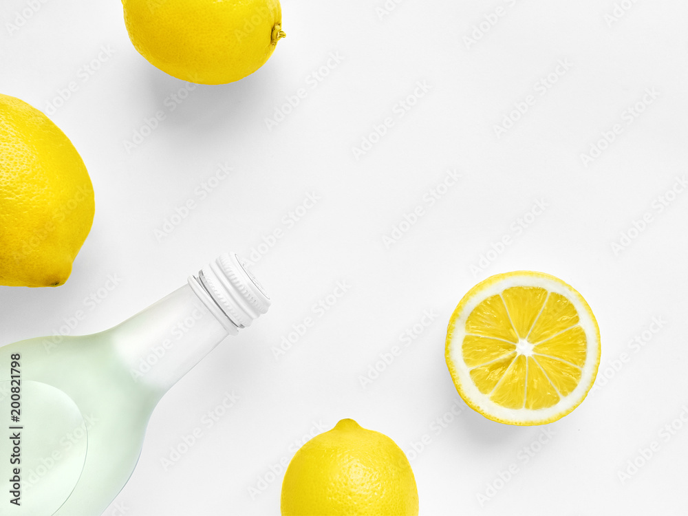 Lemonade in bottle Transparent glass bottle with lemonade, three whole ...