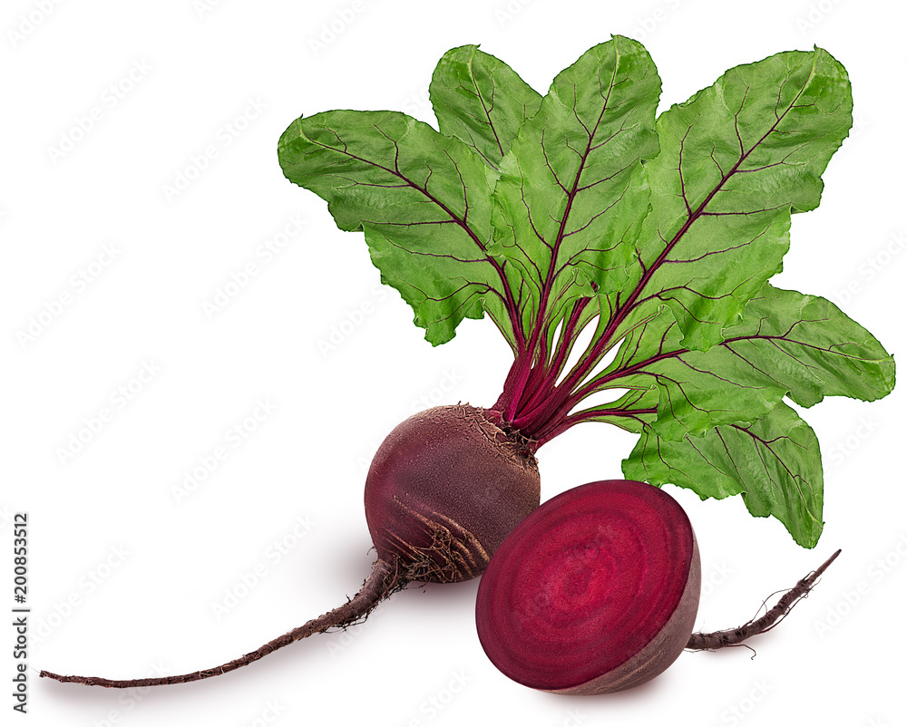 Fresh red beet root one whole and cut in half with green leaf Stock ...