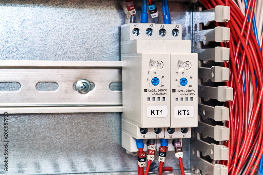 Two time relays with adjustments in the electrical Cabinet. The relays ...