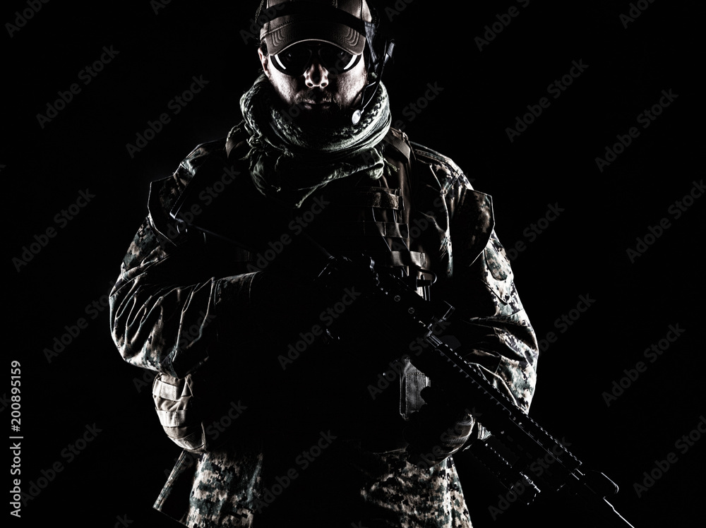 Studio shot of United States Marine with rifle weapons in uniforms ...