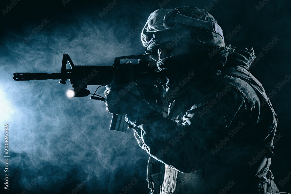Studio shot of United States Marine with rifle weapons in uniforms ...