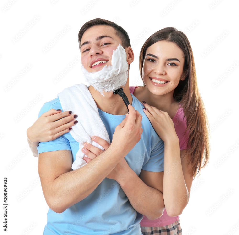 Young man shaving and his girlfriend on white background Stock Photo ...