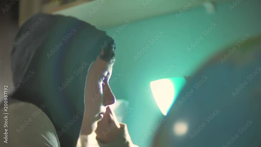 Video Stock Hacker man programmer in the hood using computer for hack ...